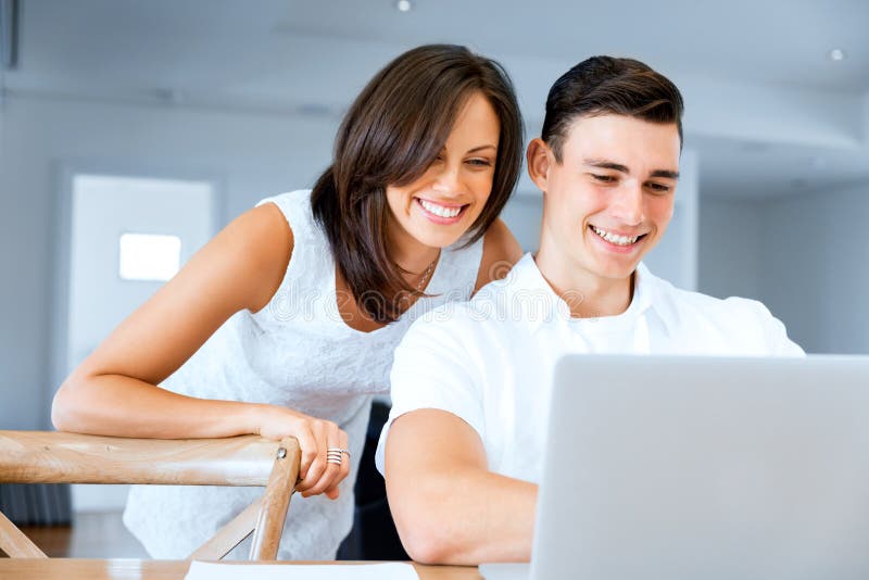 Happy Modern Couple Working on Laptop at Home Stock Image - Image of ...