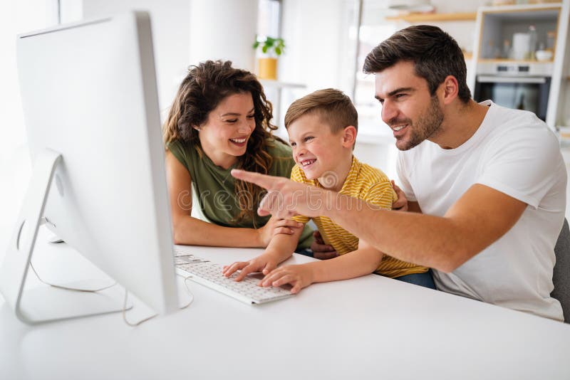 Happy Modern Family Using Computer Together at Home Stock Image - Image ...