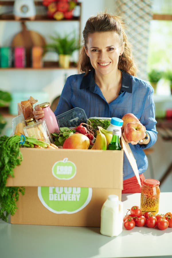 Happy Modern Female with Food Box in Kitchen Stock Photo - Image of ...