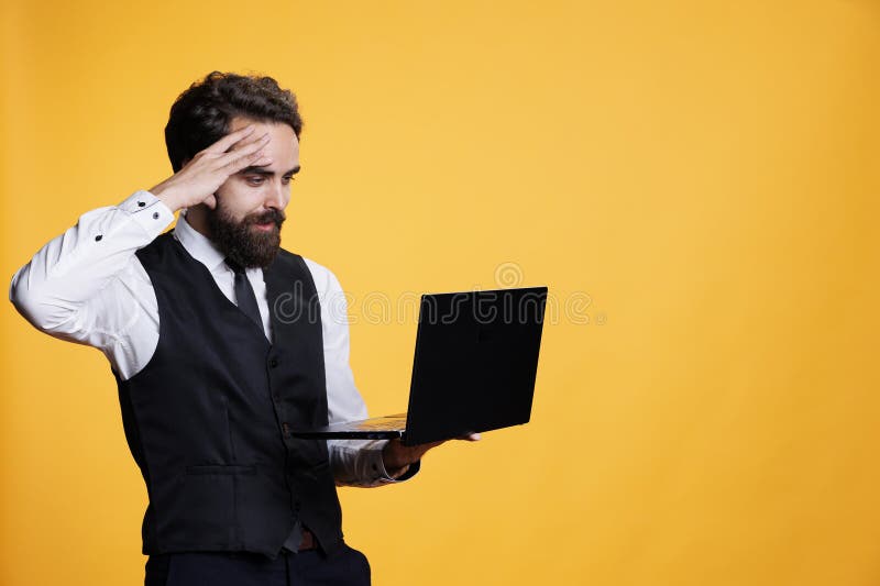 Happy Modern Waiter Using Laptop Stock Image - Image of studio ...