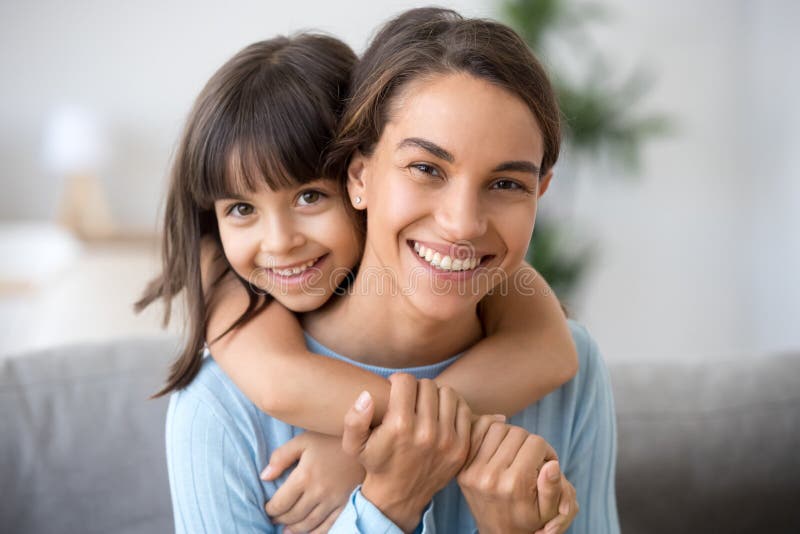 Happy Mom and Cute Kid Daughter Embracing Looking at Camera Stock Photo ... Happy Mom and Cute Kid Daughter Embracing Looking at Camera Stock Photo ...