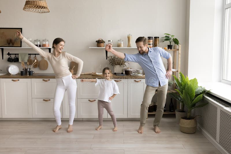 Happy Mom, Dad and Cute Toddler Kid Dancing in Kitchen Stock Image ...