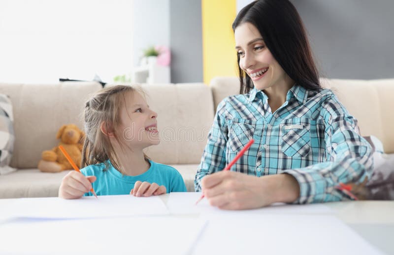 Happy Mom and Daughter Draw with Pencils on Paper Stock Photo - Image ...