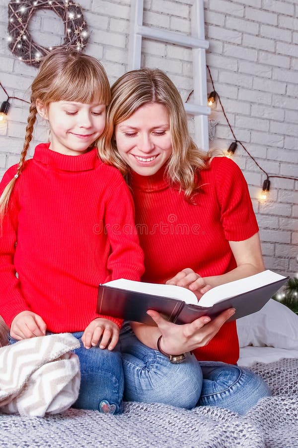 Happy Mom and Kids Read Book at Home at Christmas Stock Photo - Image ...