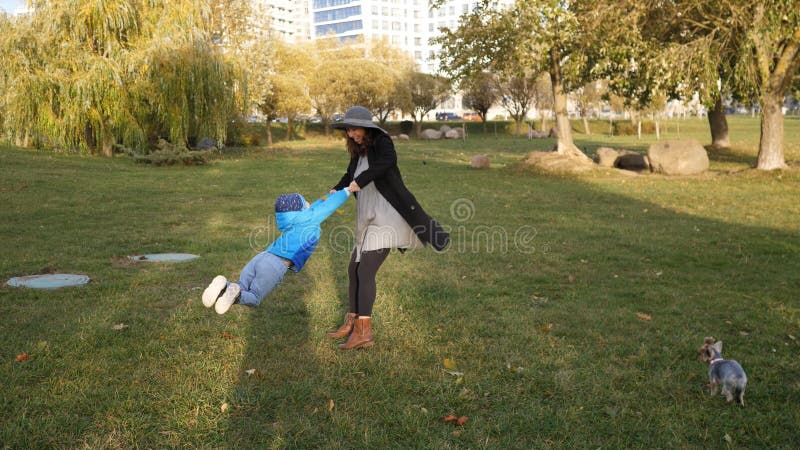 Happy Mom and Son Playing in a Spring Park Stock Image - Image of ...