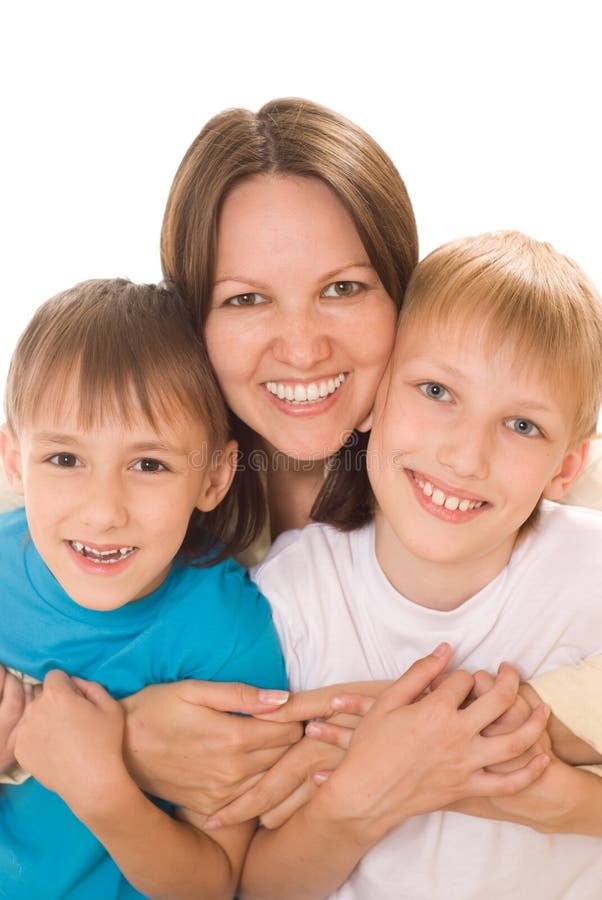 Happy Mother and Her Children Lying on a Bed Stock Image - Image of ...