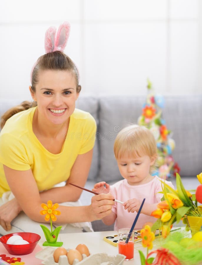 Happy Mother and Baby Painting on Easter Eggs Stock Image - Image of ...