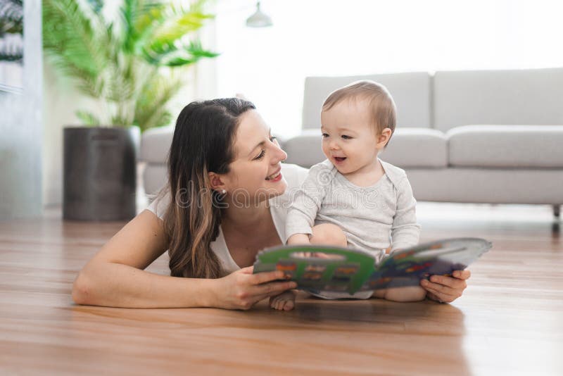 A Happy Mother with Baby Reading Book Stock Photo - Image of learning ...