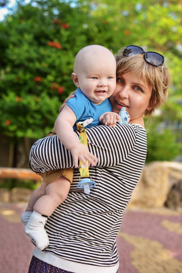 Happy mother with baby son stock photo. Image of baby - 162404130