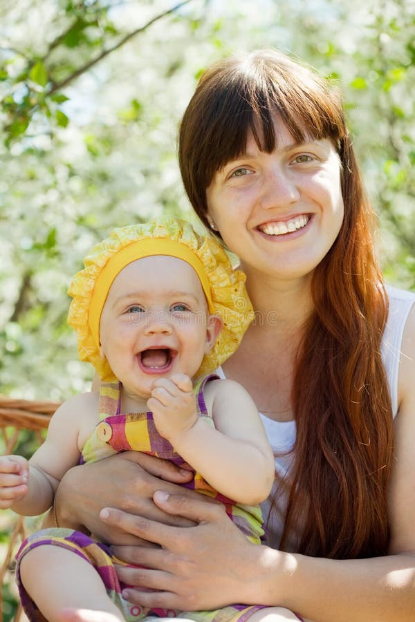 Happy Mother with Baby in Spring Stock Photo - Image of mother ...