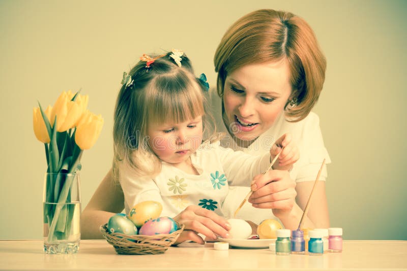 Happy Mother and Child Daughter with Brush Coloring Easter Eggs Stock ...