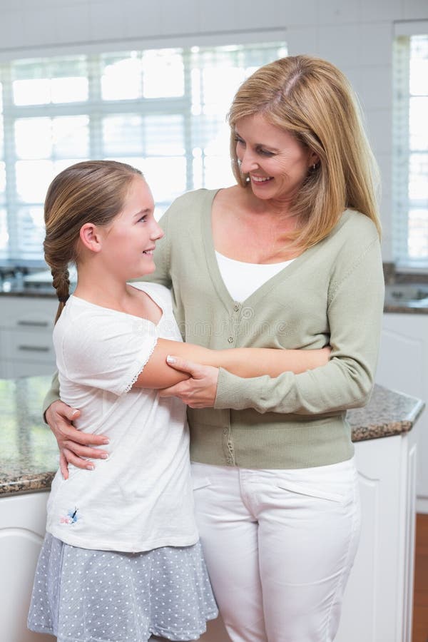 Happy Mother and Daughter Embracing Stock Photo - Image of indoors ...