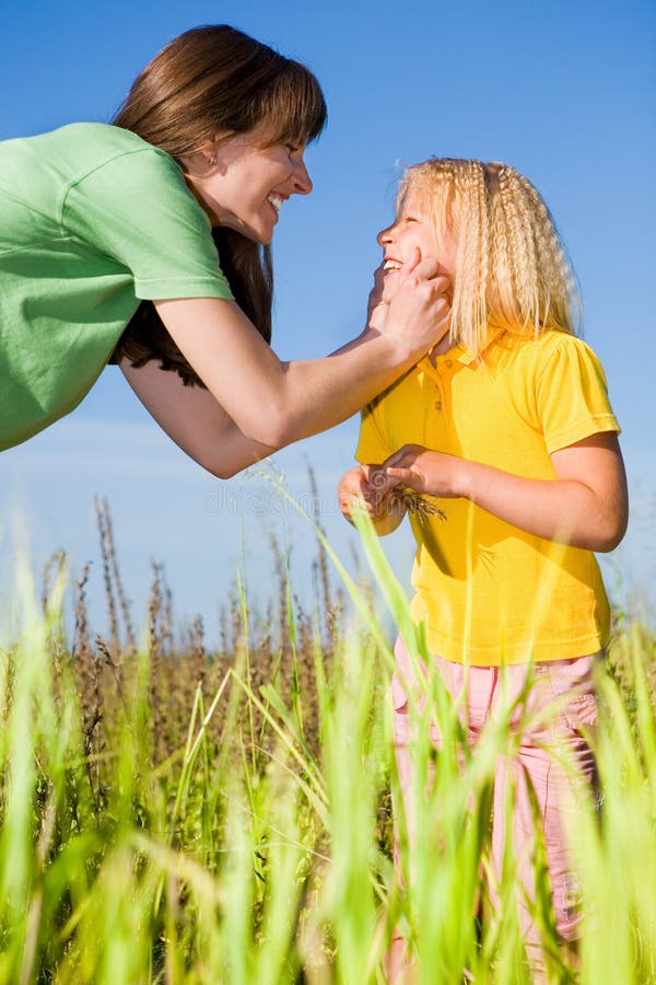 Happy Mother And Daughter Laughing On Field Stock Image - Image of ...