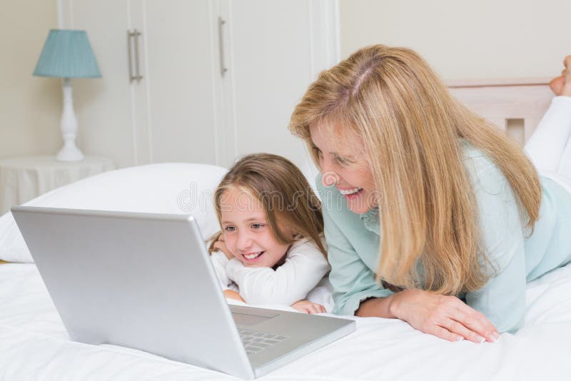 Happy Mother and Daughter Using Laptop Stock Photo - Image of apartment ...