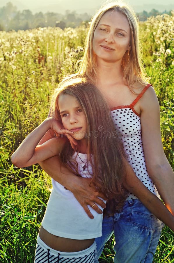 Happy mother and dougther stock photo. Image of embrace - 19611454