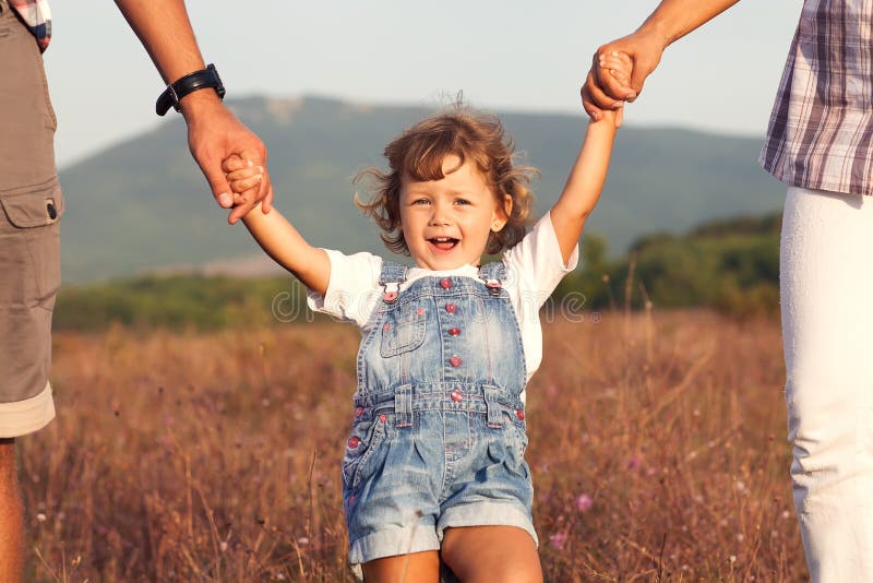 Happy mother and father stock image. Image of meadow - 34129865