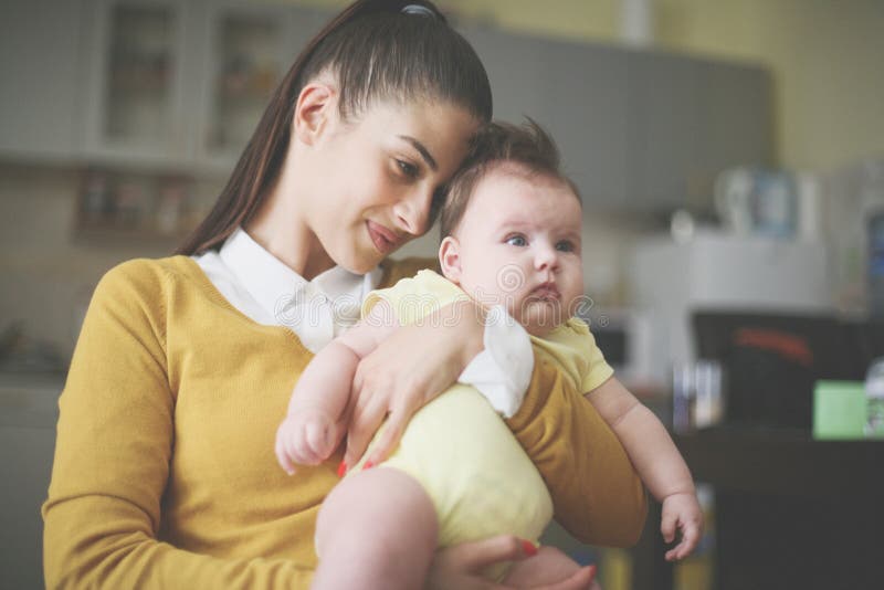Mother Standing in Kitchen with Little Baby Stock Photo - Image of ...