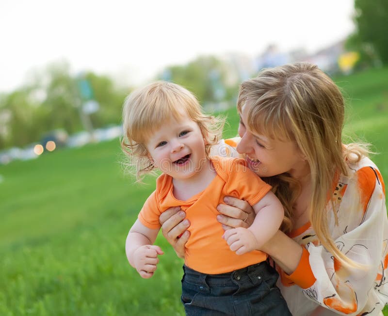 Happy mother and son stock image. Image of lawn, people - 16563477