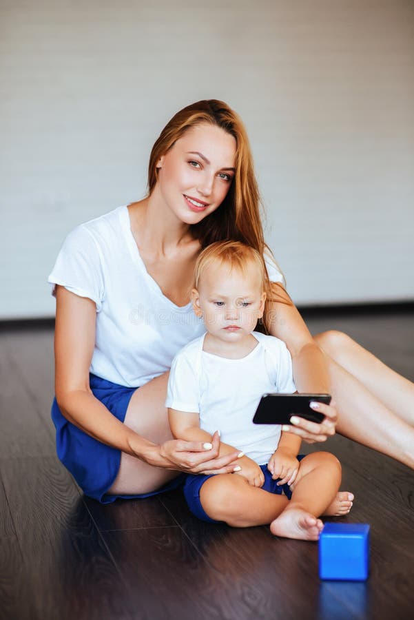Happy Mother with Son and Smartphone Stock Photo - Image of electronics ...