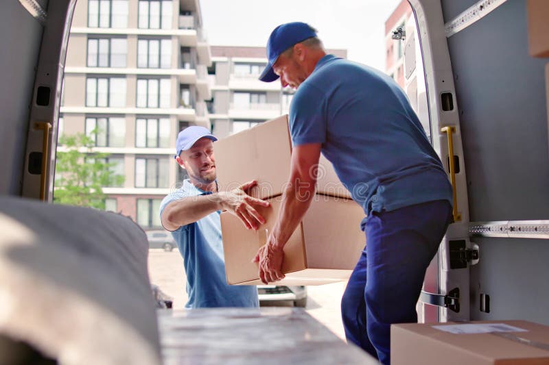 Happy Movers Loading Truck with Items Stock Photo - Image of relocation ...