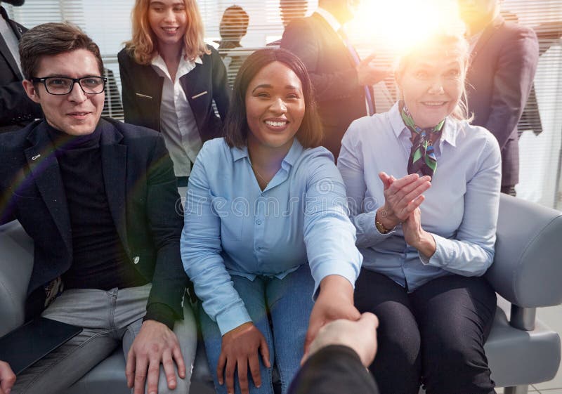 Happy Multi Ethnic Co-workers Handshaking in the Office Stock Image ...
