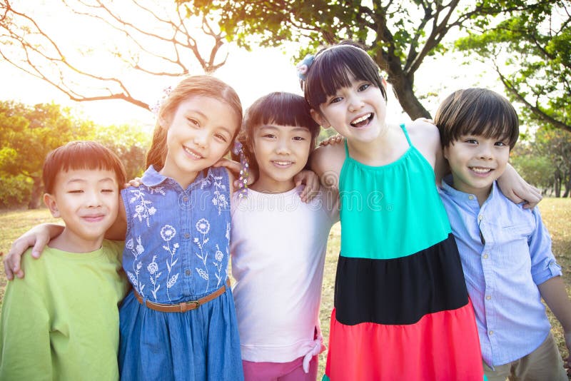 Multi-ethnic Group of Schoolchildren in Park Stock Photo - Image of ... Multi-ethnic Group of Schoolchildren in Park Stock Photo - Image of ...