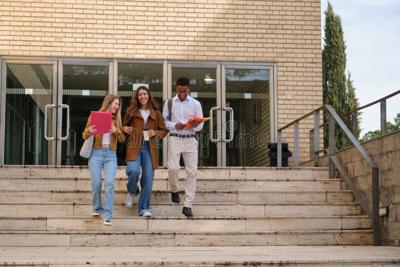 Happy Multi Ethnic Students Walking Down University Stairs after Class ...