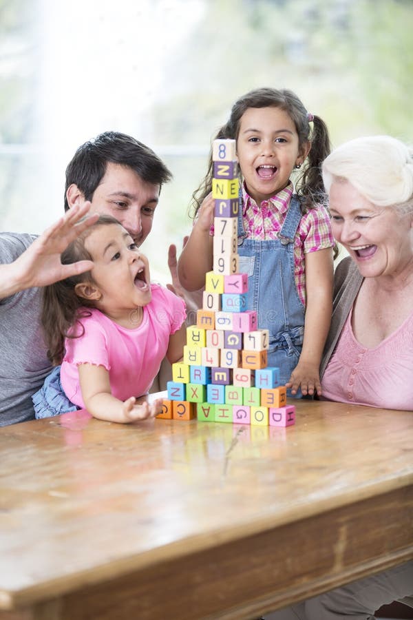 Happy Multi Generation Family with Arranged Building Blocks at Table in ...