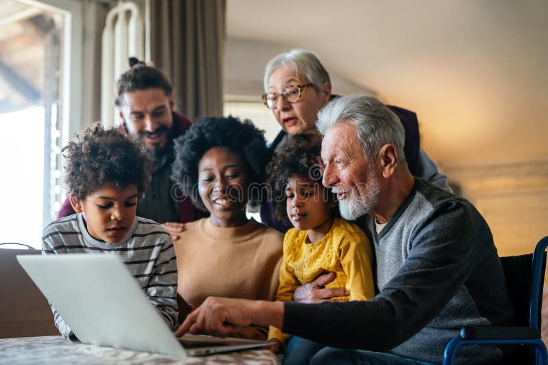 Happy Multi-generation Family Gathering Around Notebbok and Having Fun ...