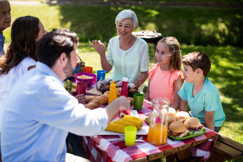 Happy Multi Generation Family Having Meal on Table Stock Photo - Image ...