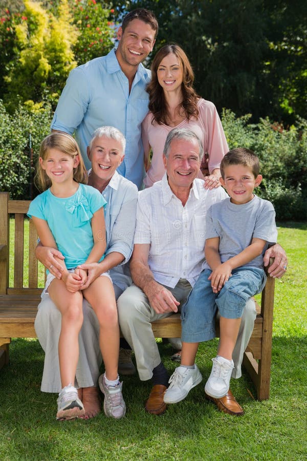 Happy Multi Generation Family Sitting in the Park Stock Image - Image ...