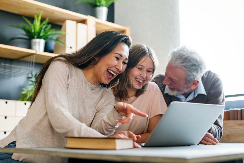 Happy Multi Generation Multiethnic Family Spend Time Online with Computer Together at Home ...