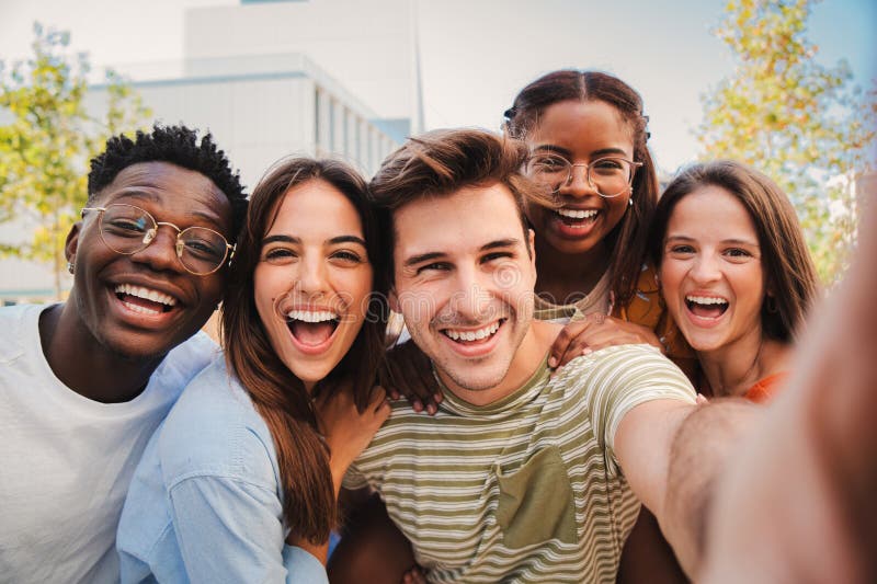 Happy Multicultural Friends Laughing Taking A Selfie Portrait Together