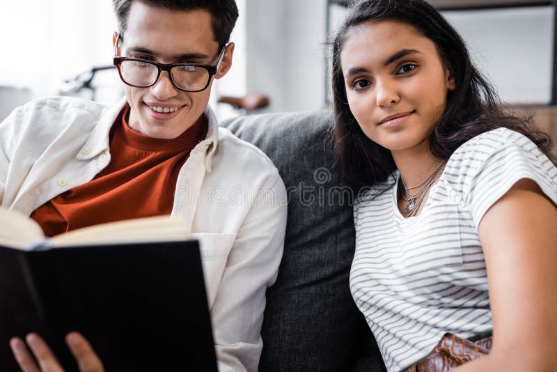 Happy, Multicultural Students Smiling and Reading Book Stock Photo ...