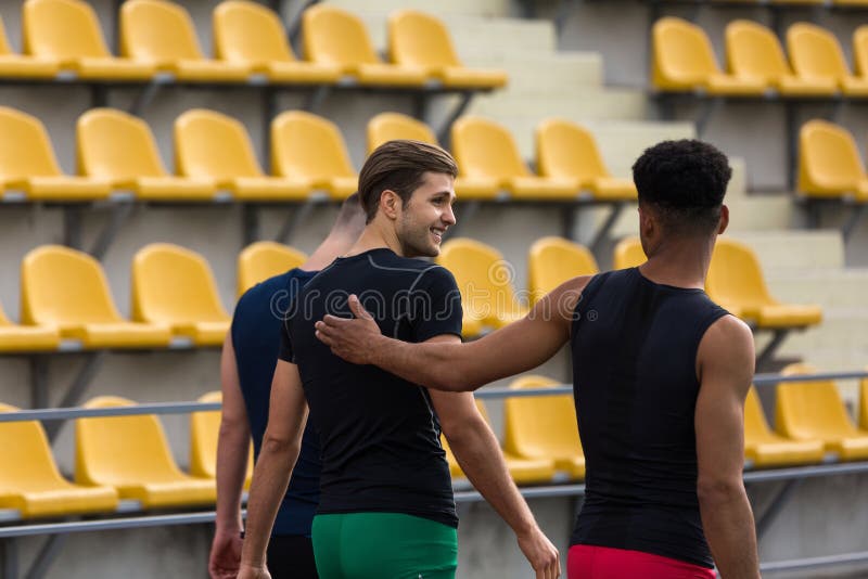 Happy Multiethnic Athlete Group Talking on Running Track Stock Image ...