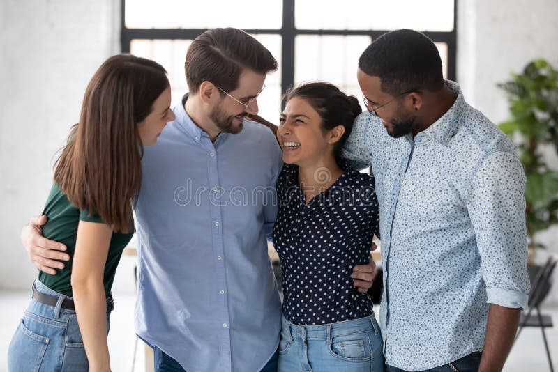 Happy Multiethnic Colleagues Show Unity at Workplace Stock Photo ...