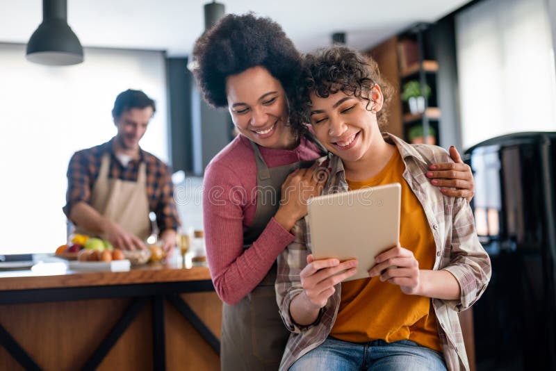 Happy Multiethnic Family Using Digital Devices for Online Study. E ...
