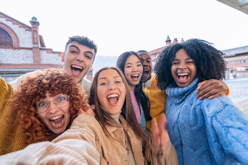 Happy Multiethnic Friends Smiling While Taking Selfies Together