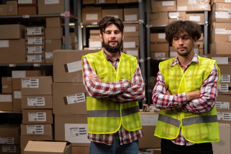 Happy Multiethnic Warehouse Workers Who Have Completed Their Work Look ...