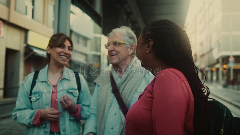 Happy Multiracial People Talking while Waiting at the Bus Station Stock ...