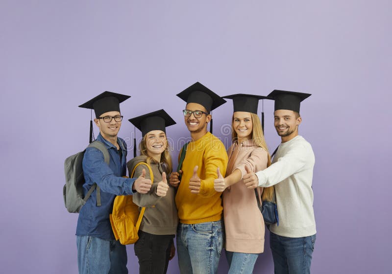 Happy Multiracial Students in Mortar Boards Showing Thumbs Up Standing ... Happy Multiracial Students in Mortar Boards Showing Thumbs Up Standing ...