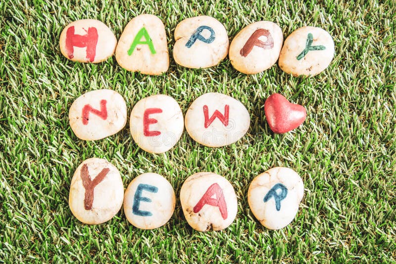 Happy New Year Paint on Stone , on the Grass Stock Photo - Image of ...