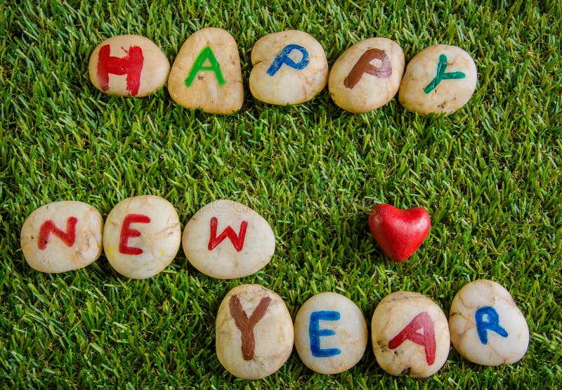 Happy New Year Paint on Stone , on the Grass Stock Photo - Image of ...