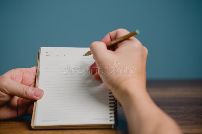 2023 Happy New Year Resolution Goal List, Hand with Pen Writing on ...