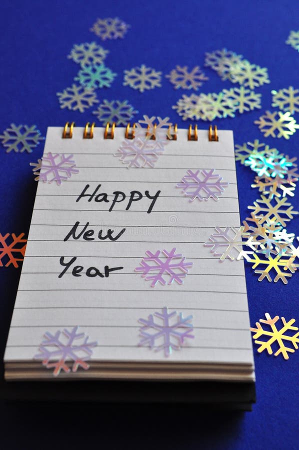 Notebook with Happy New Year Write on Blue Background Stock Photo ...