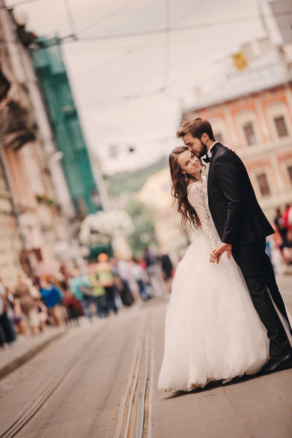 Happy Newlyweds Couple On A Walk In Old European Town Street Gorgeous