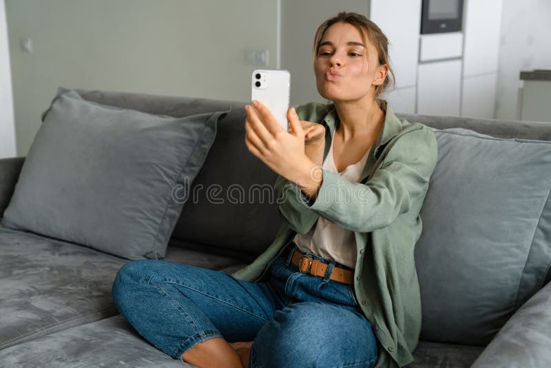 Happy Nice Woman Sending Air Kiss While Taking Selfie On Mobile Phone