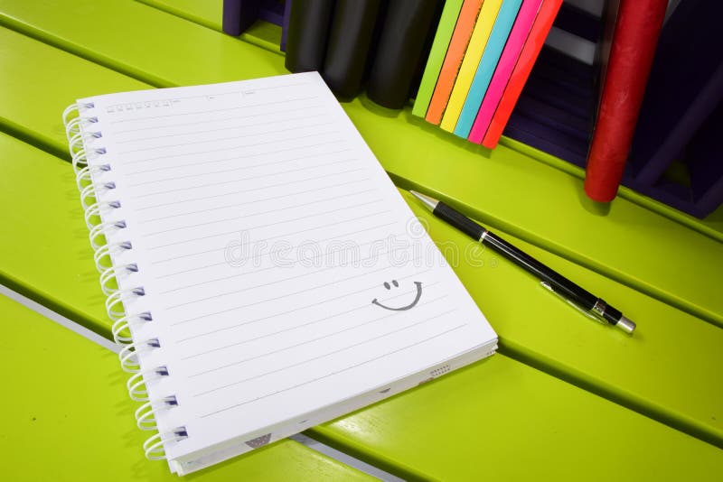 Happy Boy with Notebook and Pen Looking and Question Marks and Light ...