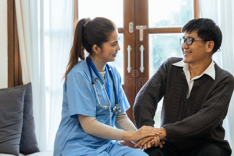 Happy Nurse Caring for an Elderly Man and Support Him To Walk with a ...