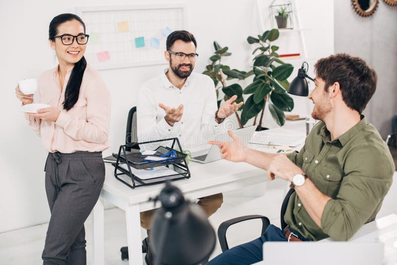 Happy Office Managers Holding Coffee Cup and Talking Stock Image ...